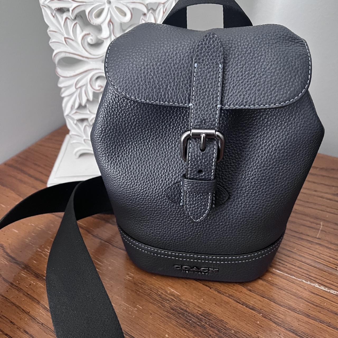 Dark navy blue sling backpack. This bag has two... - Depop