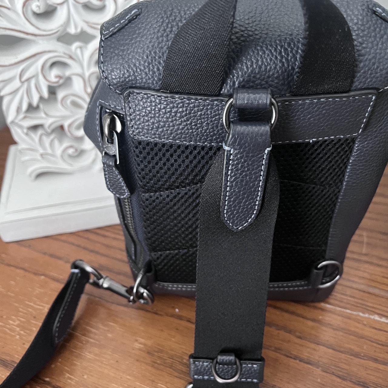 Dark navy blue sling backpack. This bag has two... - Depop