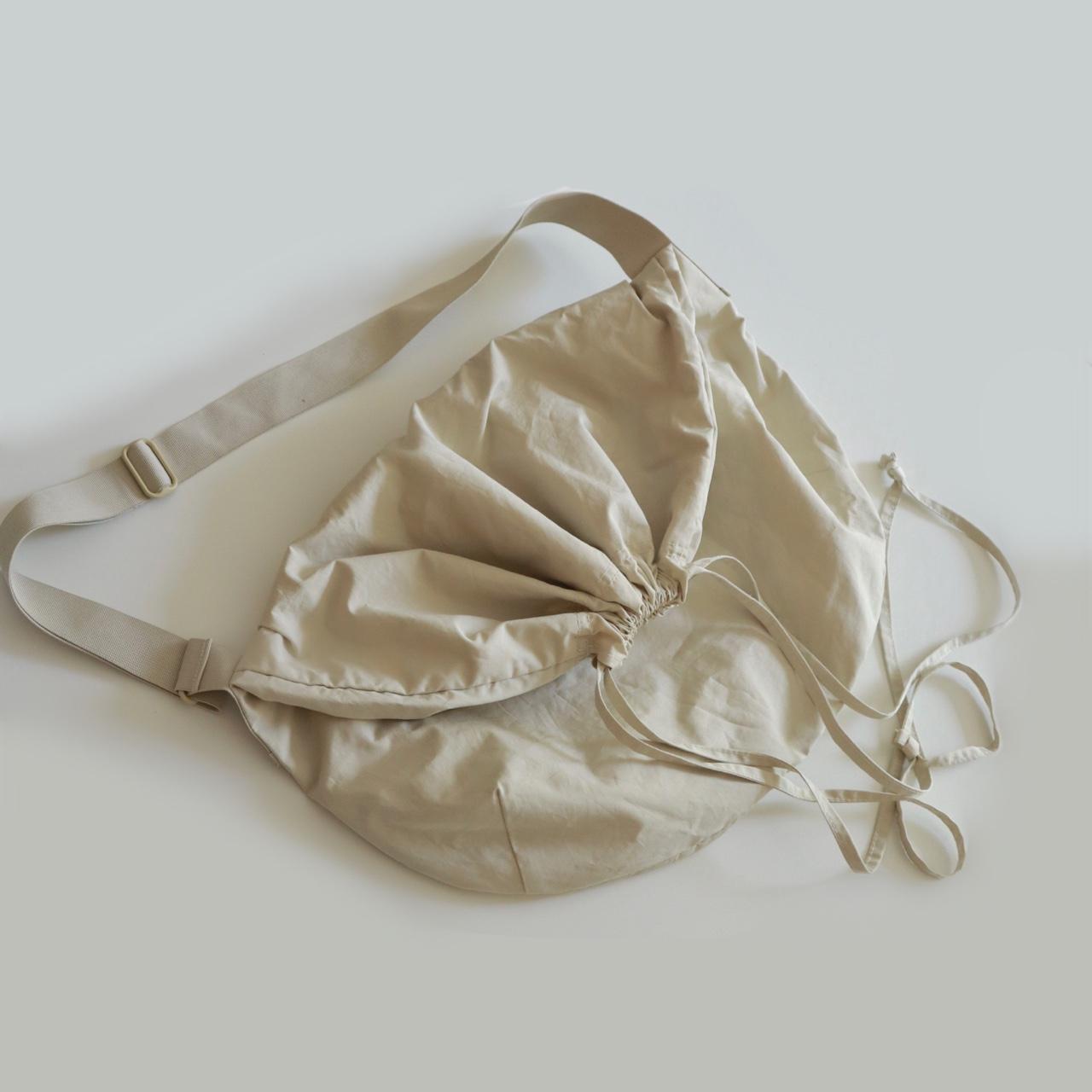 drawstring shoulder bag. beige... - Depop