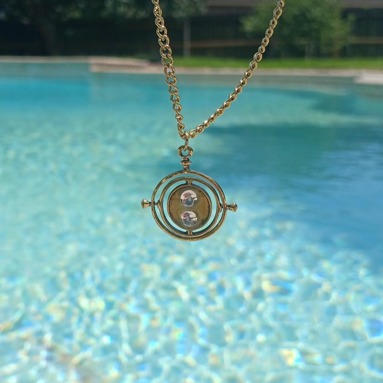 HP rotating hot topic necklace. wearable length is... - Depop