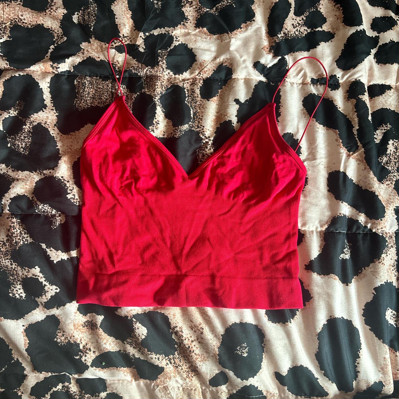 Red tank with spaghetti straps, ripped, not as red... - Depop