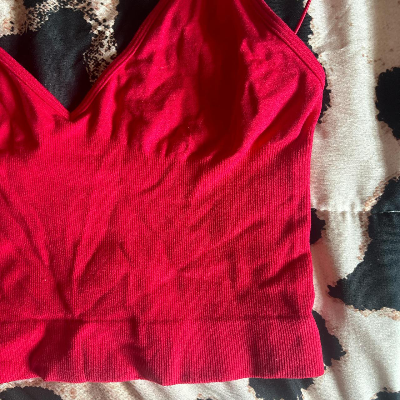Red tank with spaghetti straps, ripped, not as red... - Depop