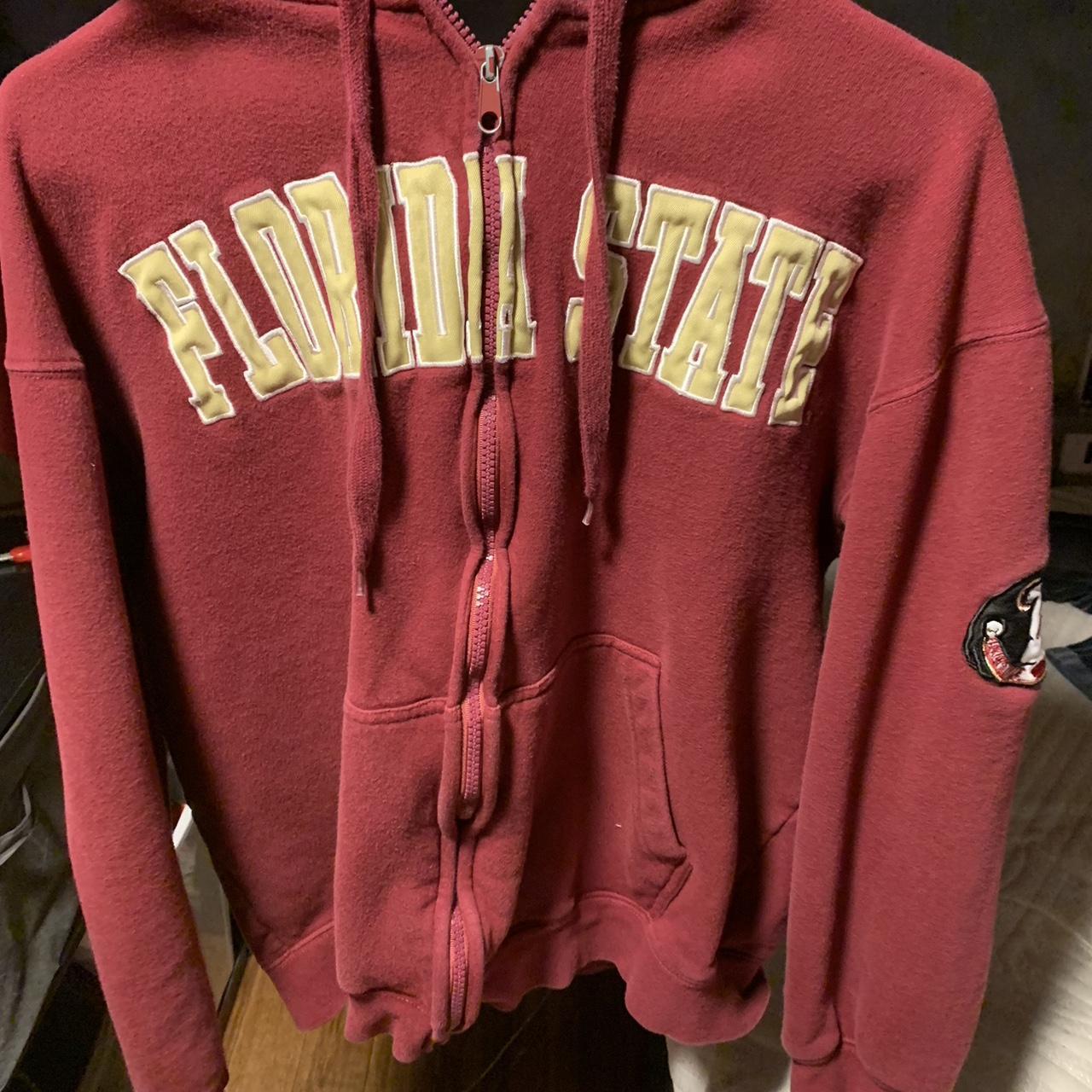 Burgundy and yellow Florida State University zip up... | Depop