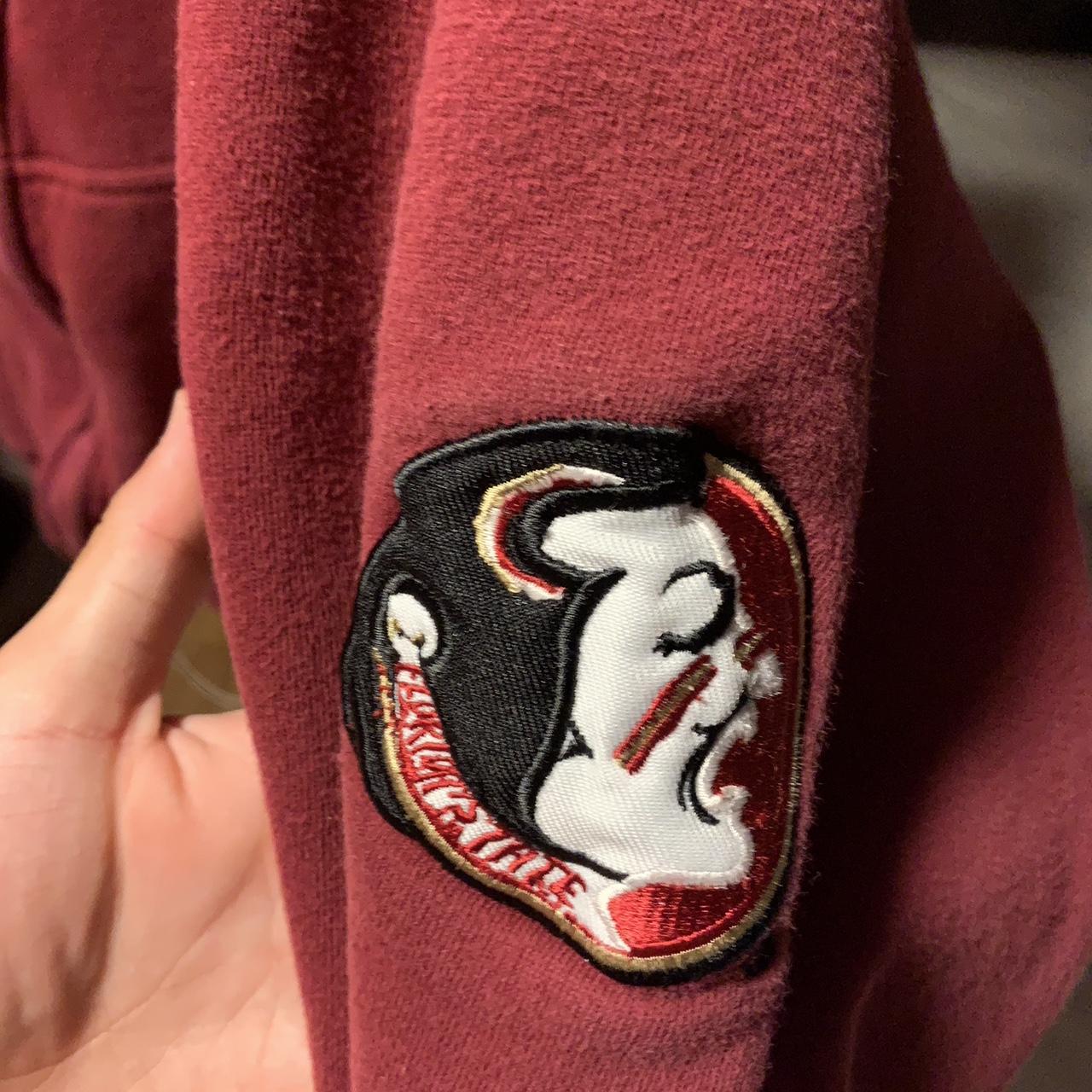 Burgundy and yellow Florida State University zip up... | Depop