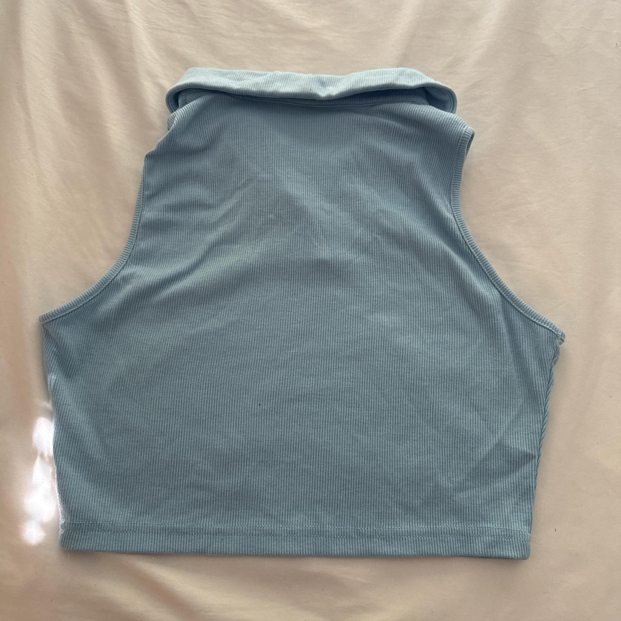 Blue cropped collared polo. Size medium. A few loose... | Depop
