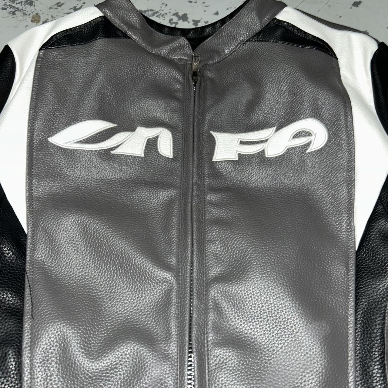 grey and black leather racing jacket with adjustable... | Depop