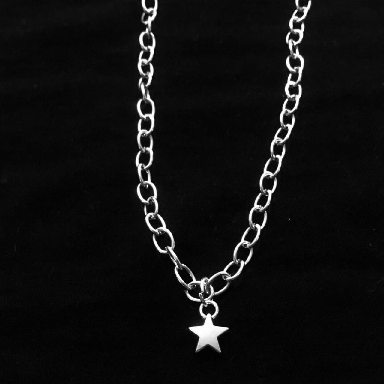 24 inches. The silver color star necklace. Chain is... - Depop
