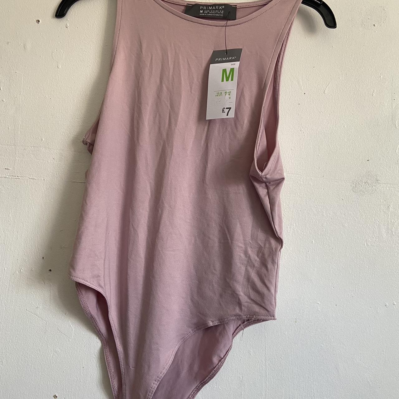 Pink bodysuit Never worn, still got tags Size M but... - Depop