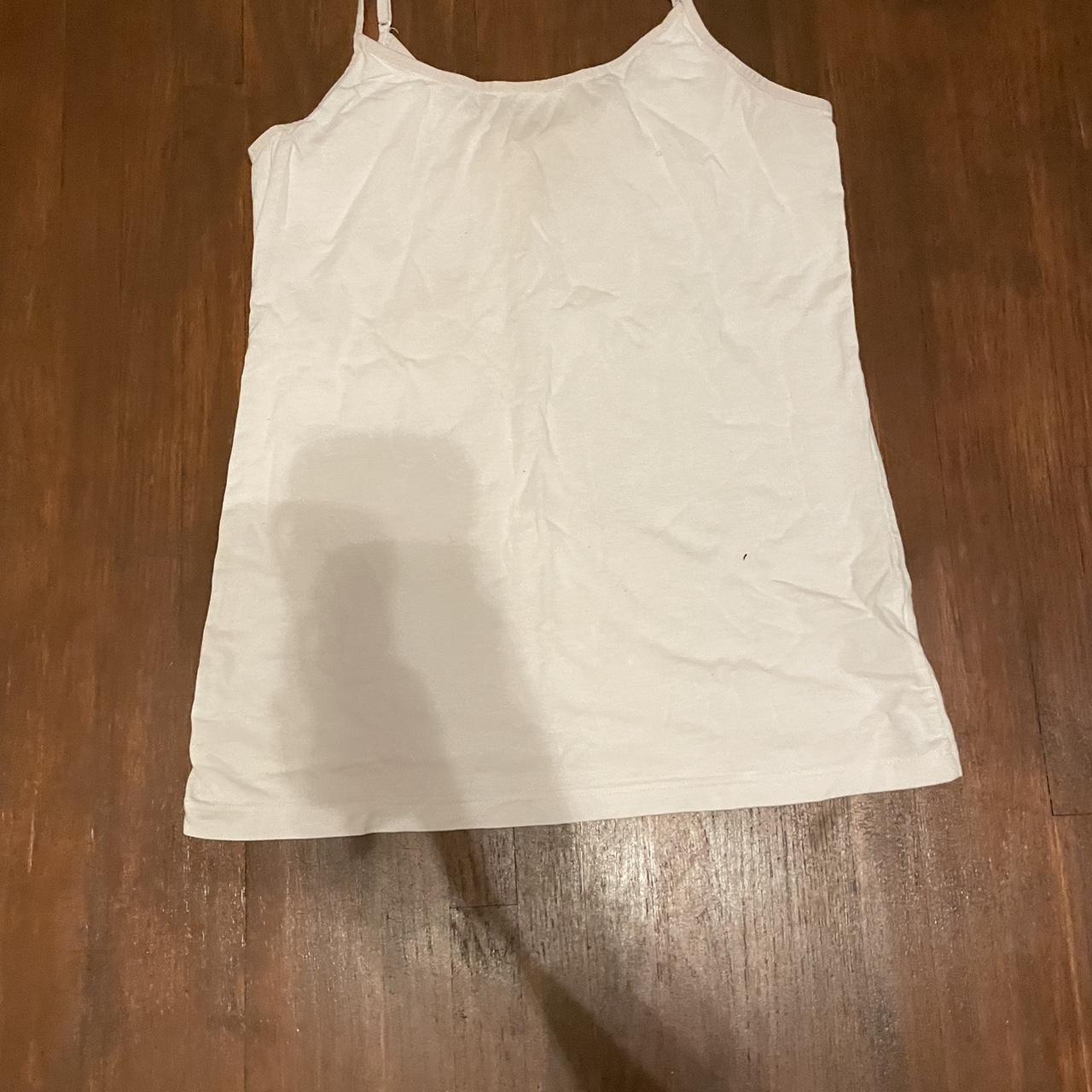 a white spaghetti strap tank top - Depop