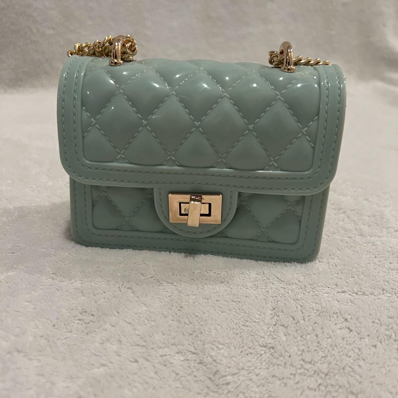 a cute small green purse with a pretty gold handle - Depop