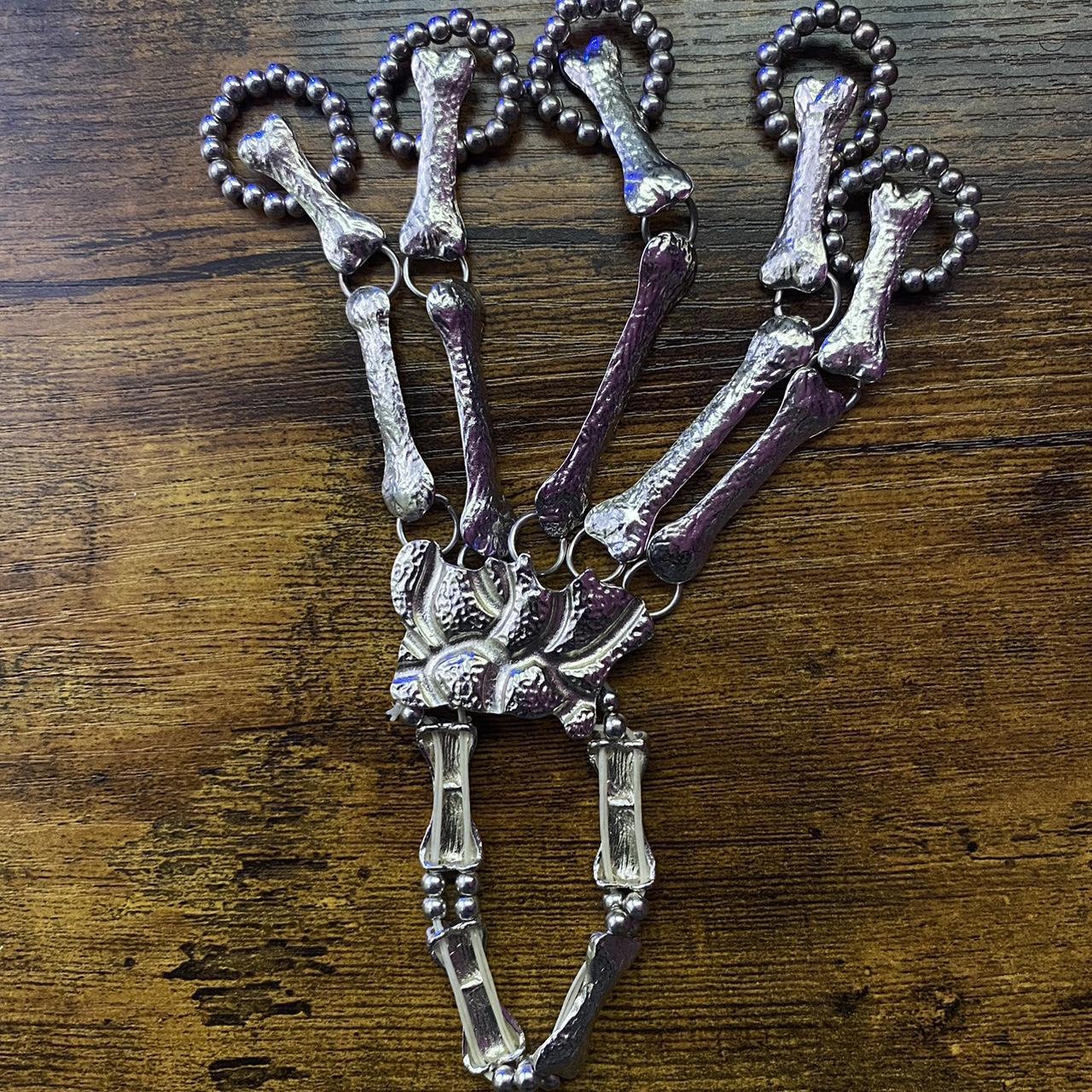 Silver skeleton hand accessory with a gothic vibe... - Depop