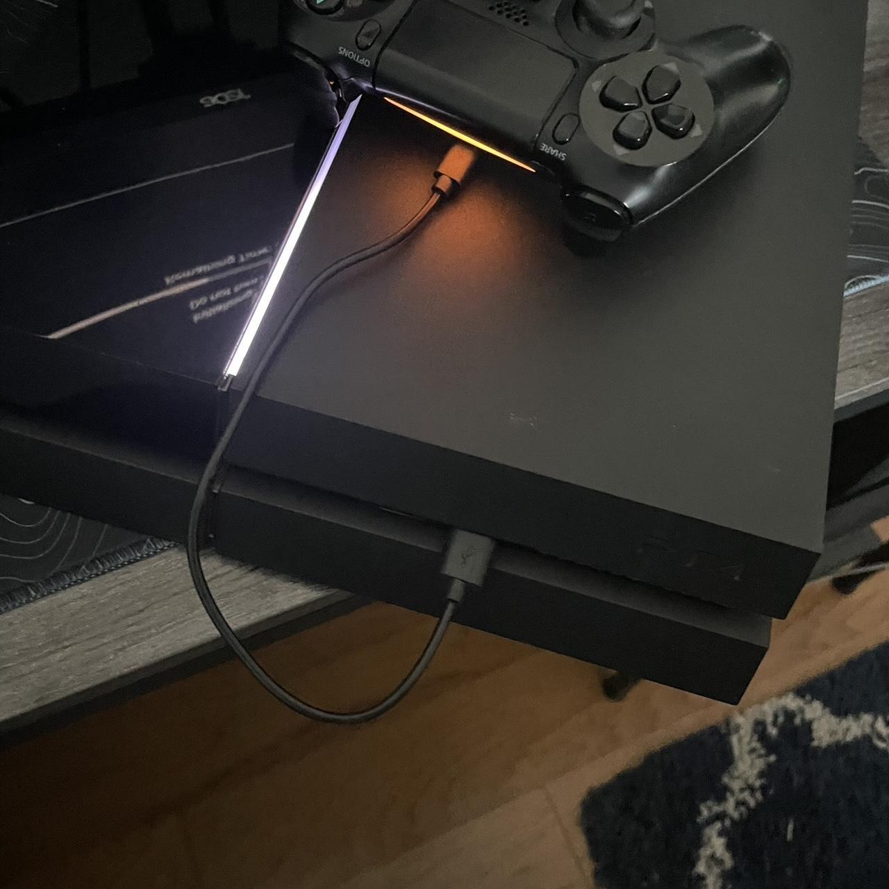 Black and grey PlayStation 4 console and DualShock 4... | Depop