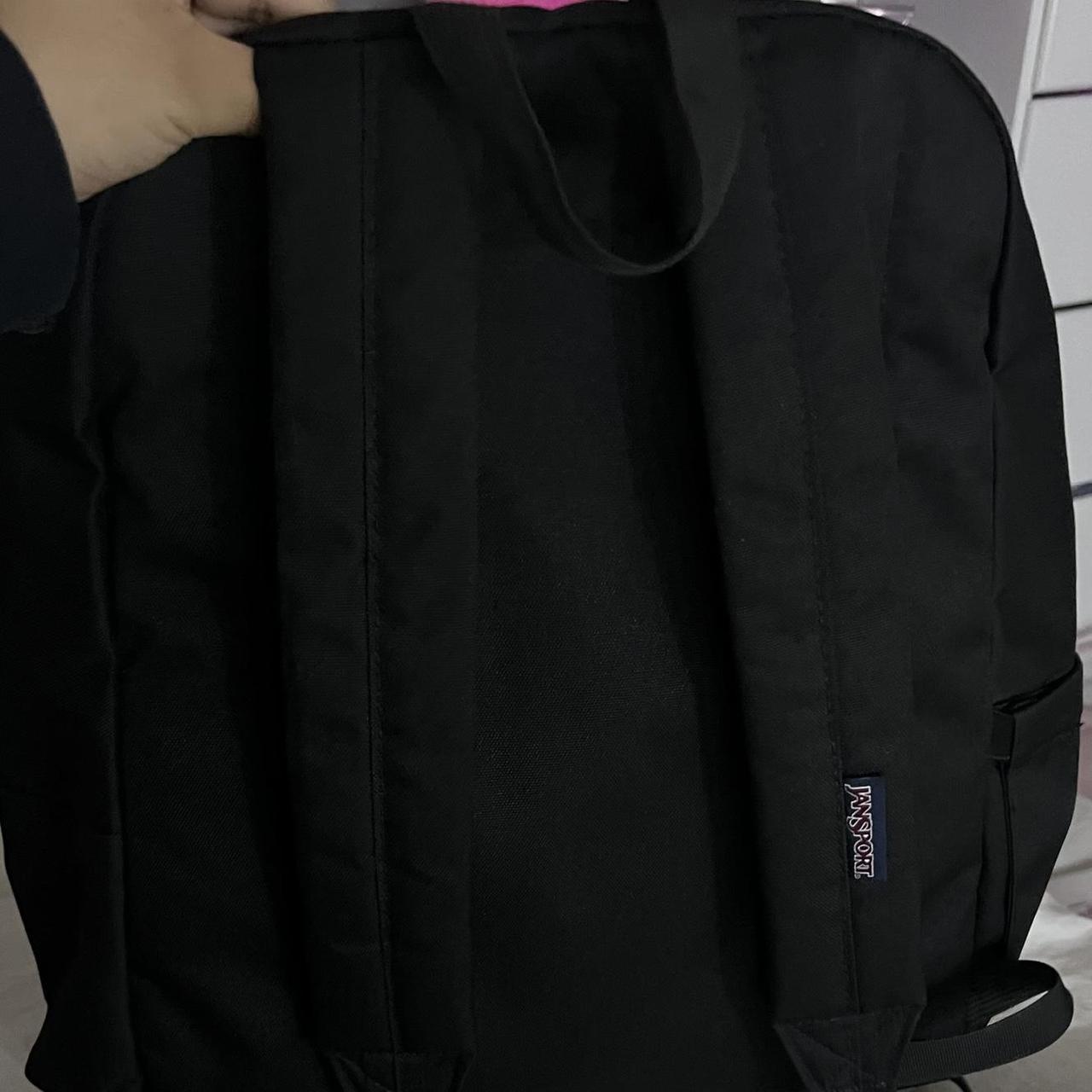 Jansport black backpack with red and blue logo... - Depop