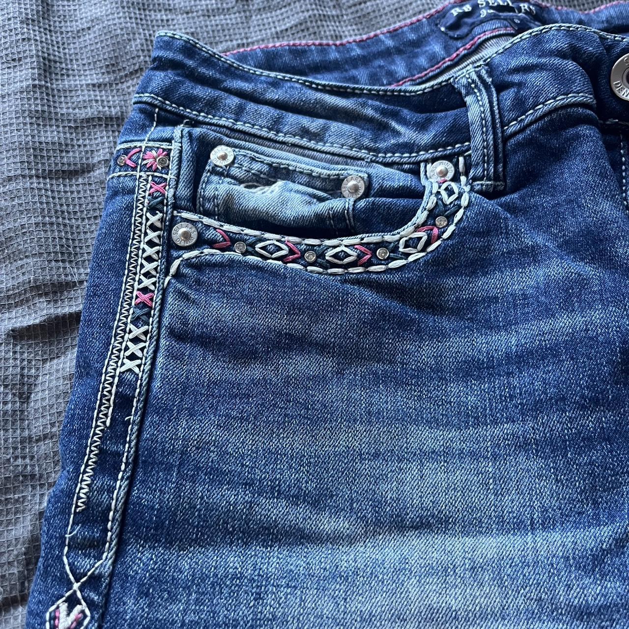 Blue low-rise jeans with embroidery detail... | Depop