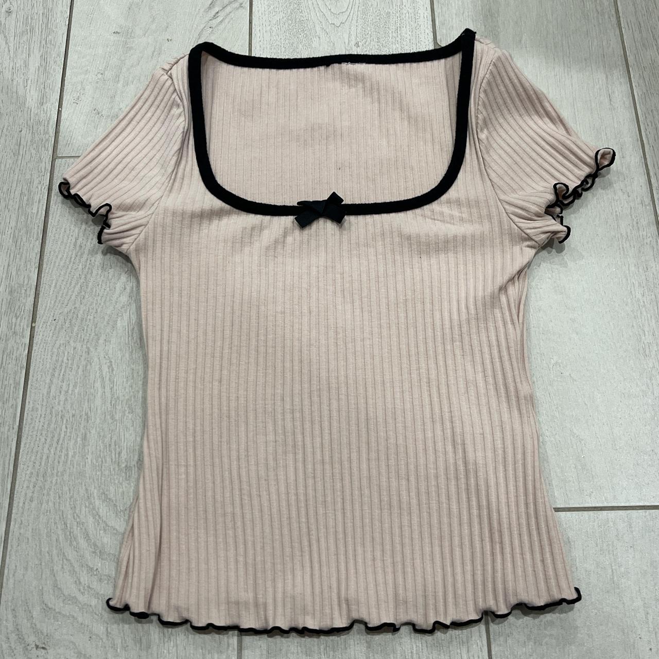 light pink ribbed top with black trim and bow... | Depop