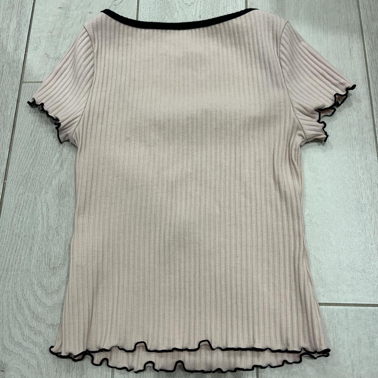 light pink ribbed top with black trim and bow... | Depop