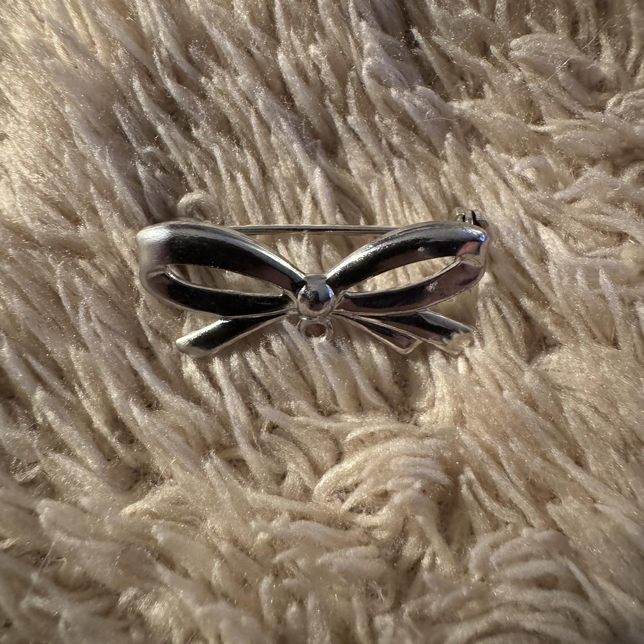 Silver bow pin - a lovely accessory for your neck or... - Depop
