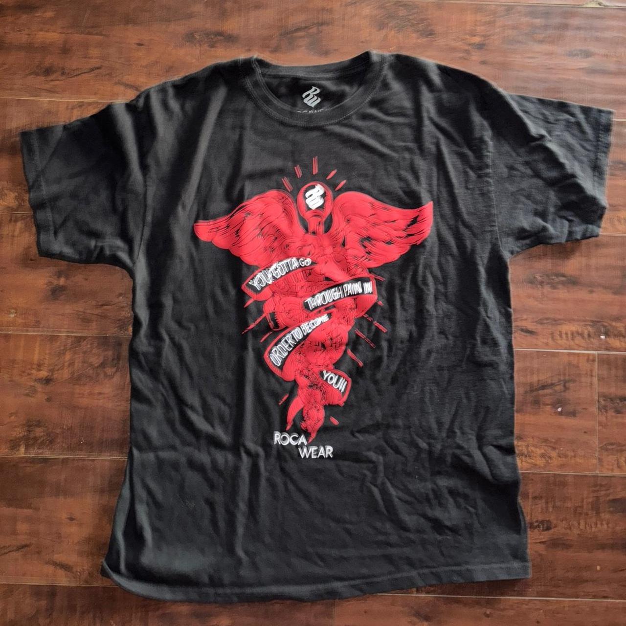 Black Rocawear streetwear tee with bold red graphics... | Depop