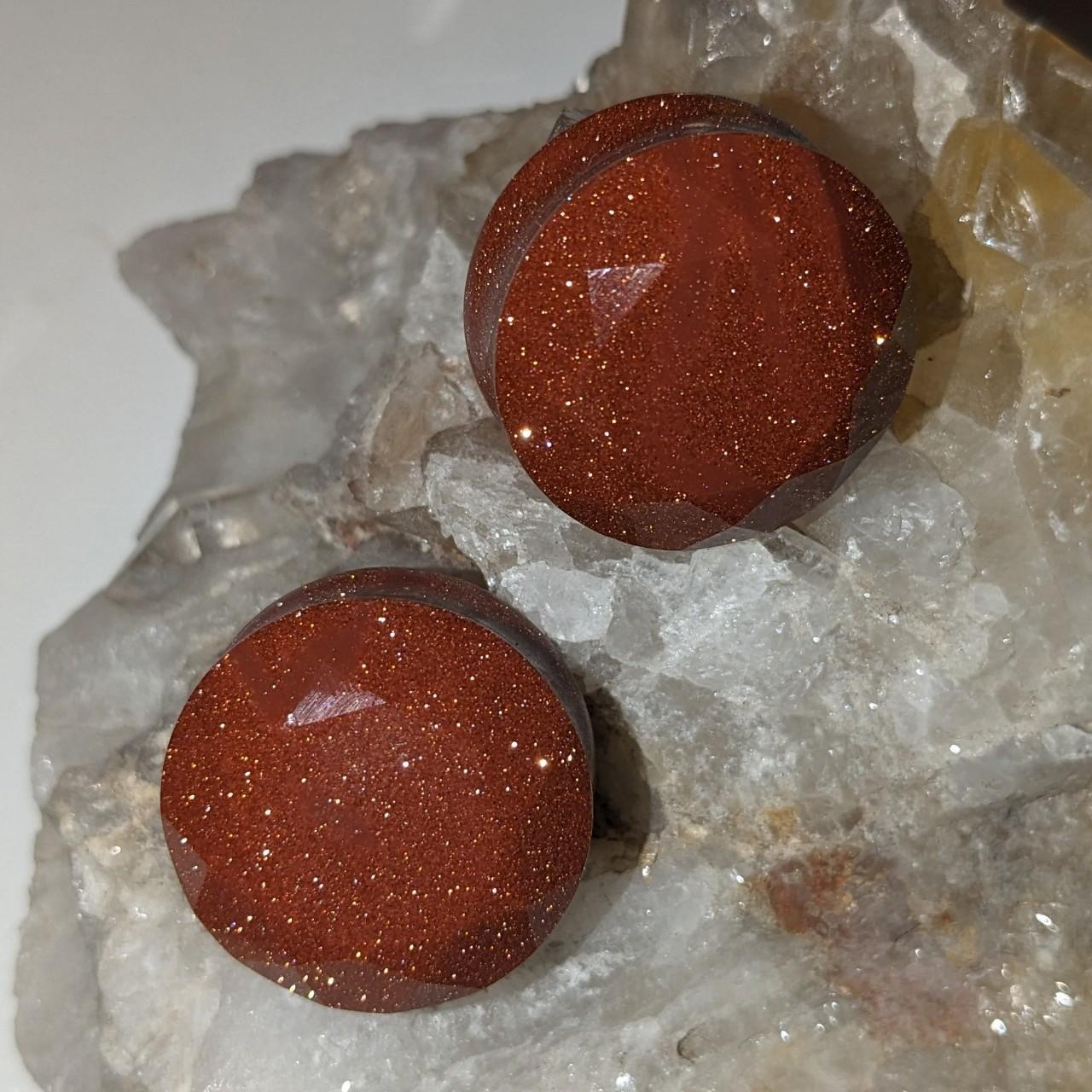 7/8" (22mm) red goldstone faceted double flare... - Depop