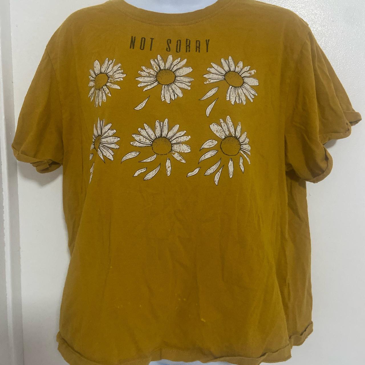 Yellow "not sorry" graphic tee with white flowers... - Depop