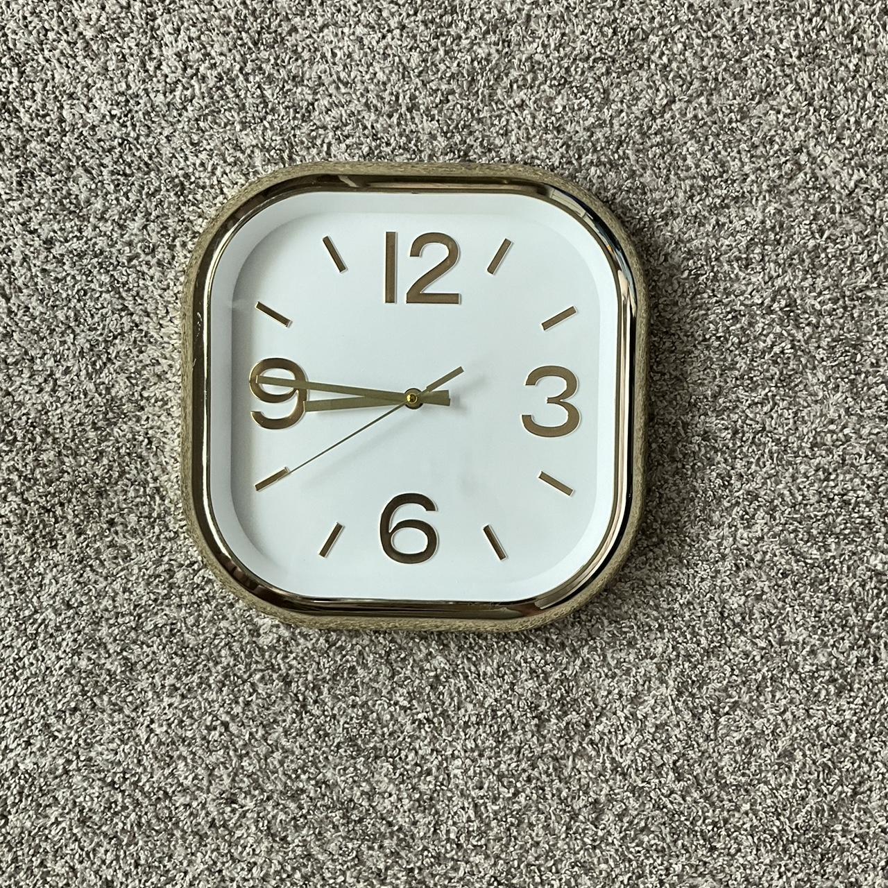 square clock with gold accents, with a white and... - Depop