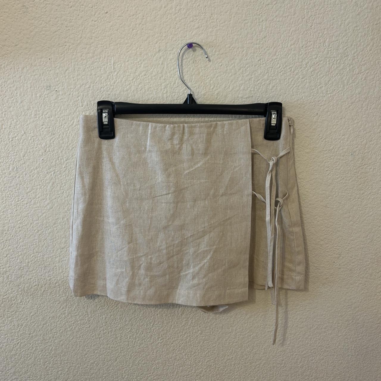 Cream linen wrap around skort with tie detail... | Depop