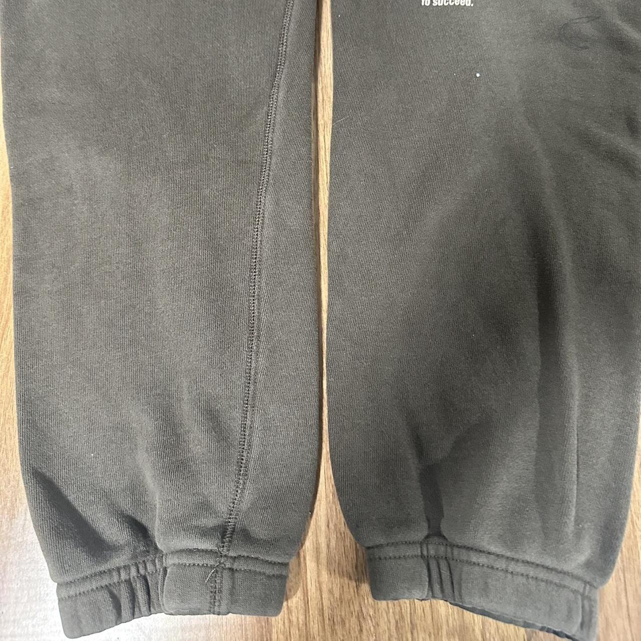 Brown and tan cuffed graphic sweatpants #youngla | Depop