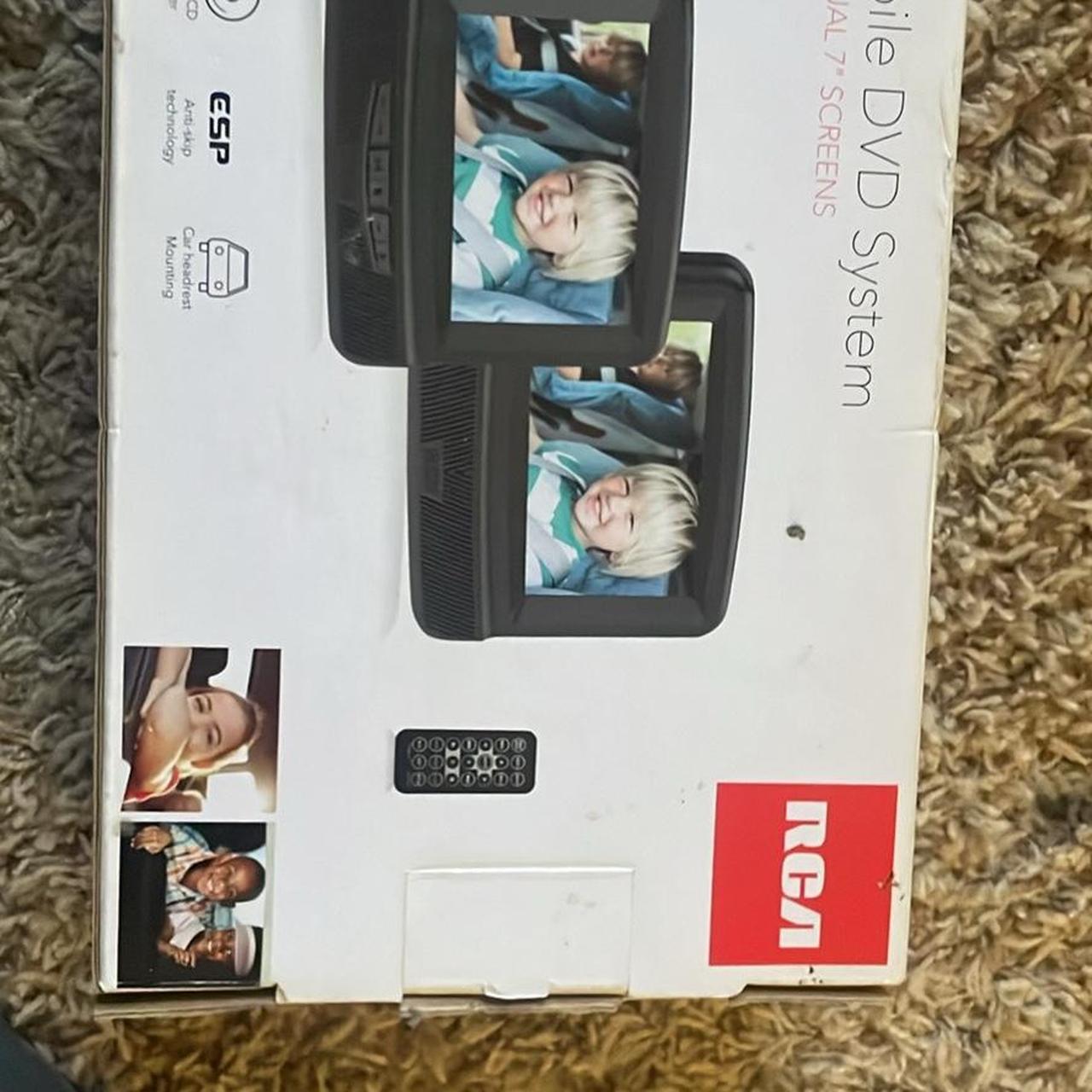 Black RCA mobile DVD system with dual 7” screens and... | Depop