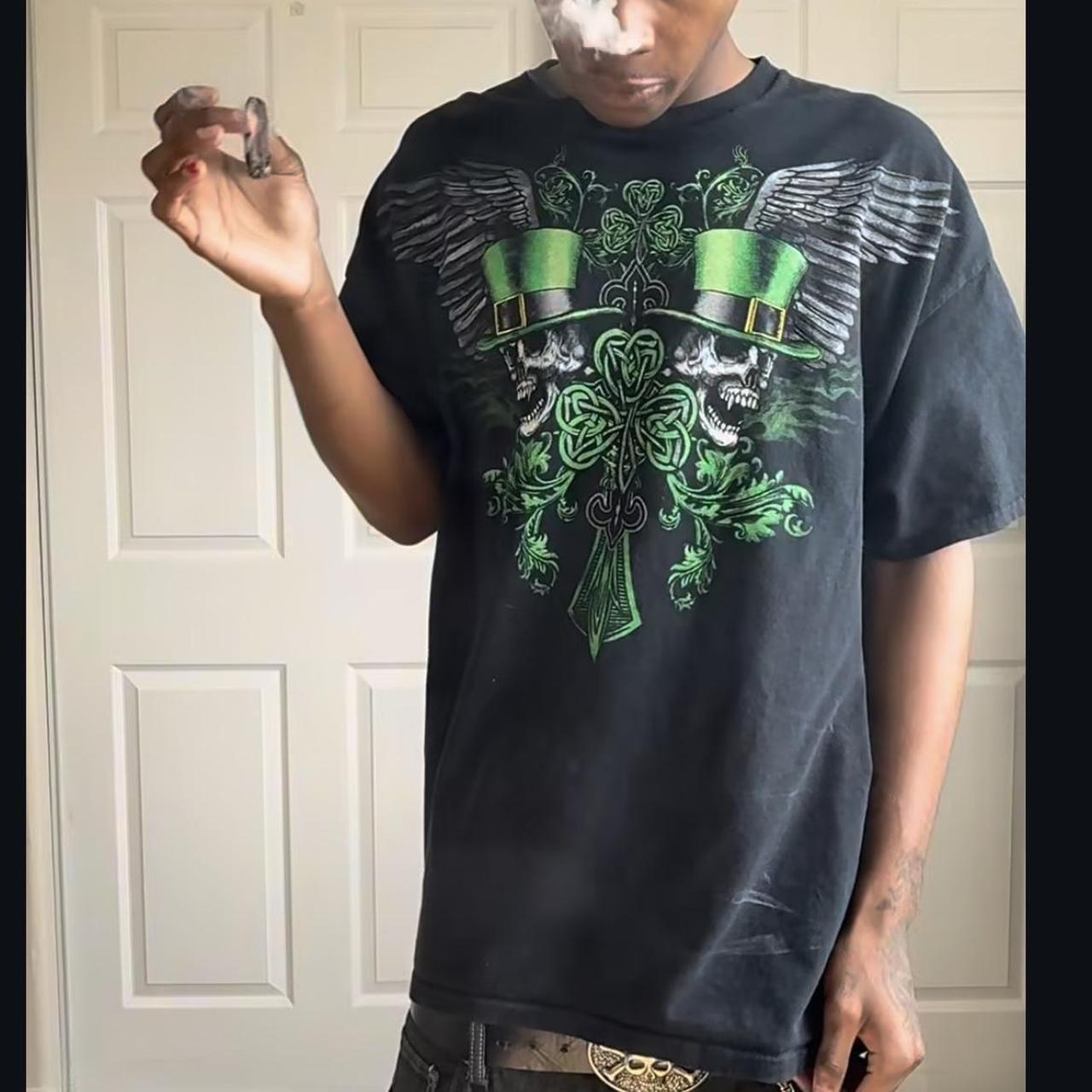 Black St Patrick's Day tee with green skulls and... | Depop
