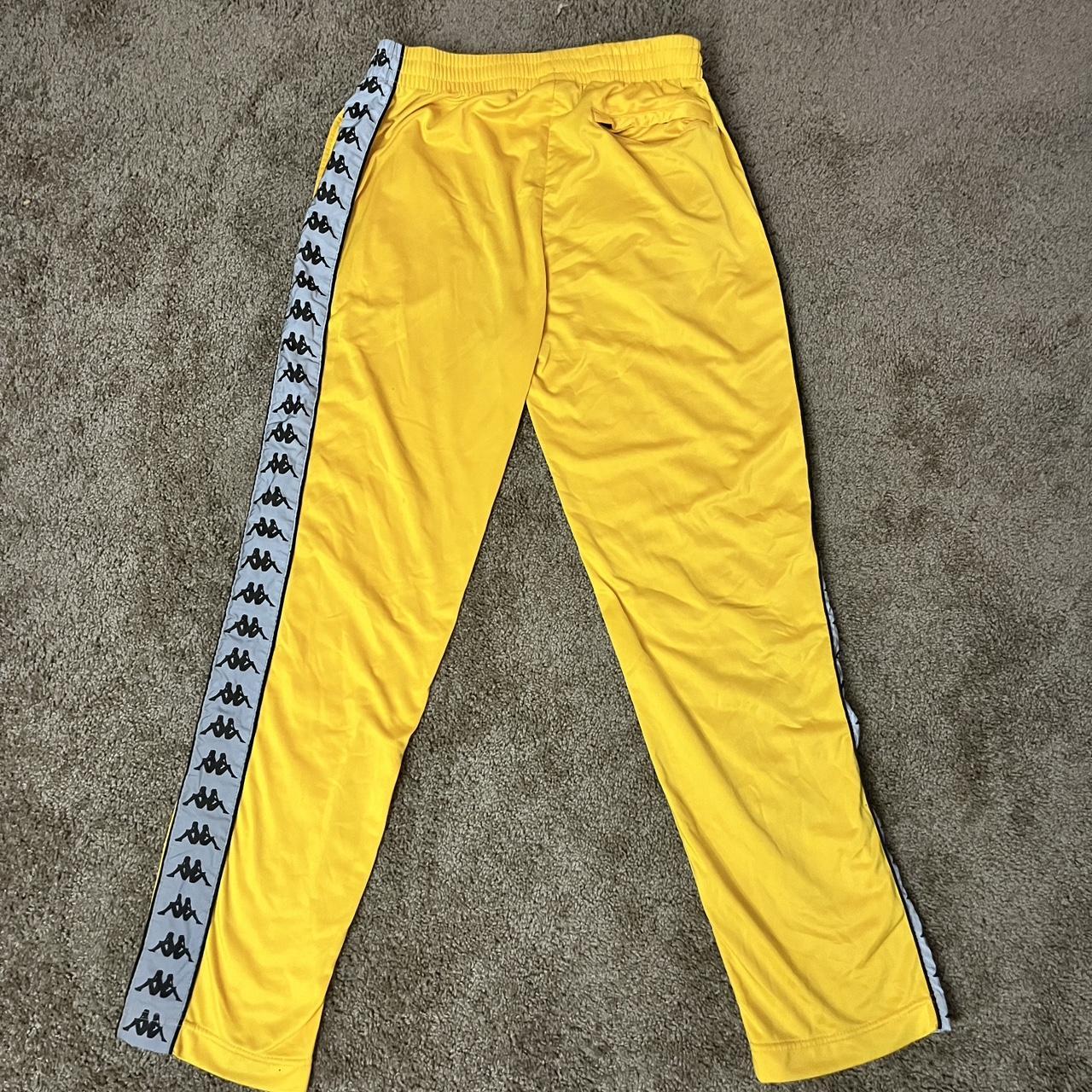 Yellow Kappa Pants Size Medium small burn hole on knee - Depop