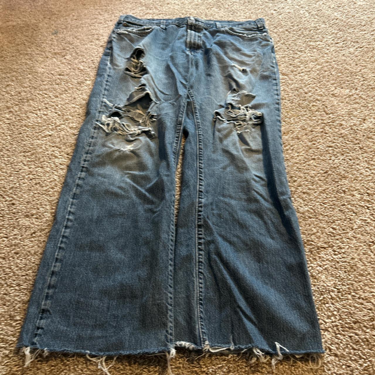 Distressed baggy blue jeans with a ripped look... | Depop