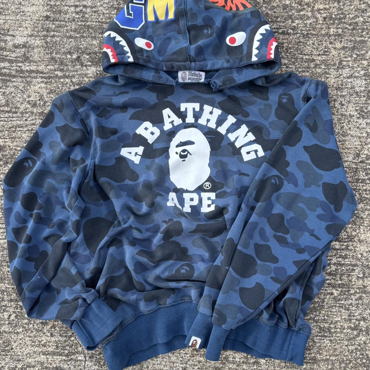 BAPE blue and black hoodie ripped neck line but not... | Depop