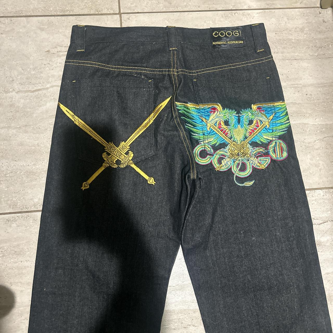 Coogi jeans with embroidered details jeans size 36x32 - Depop