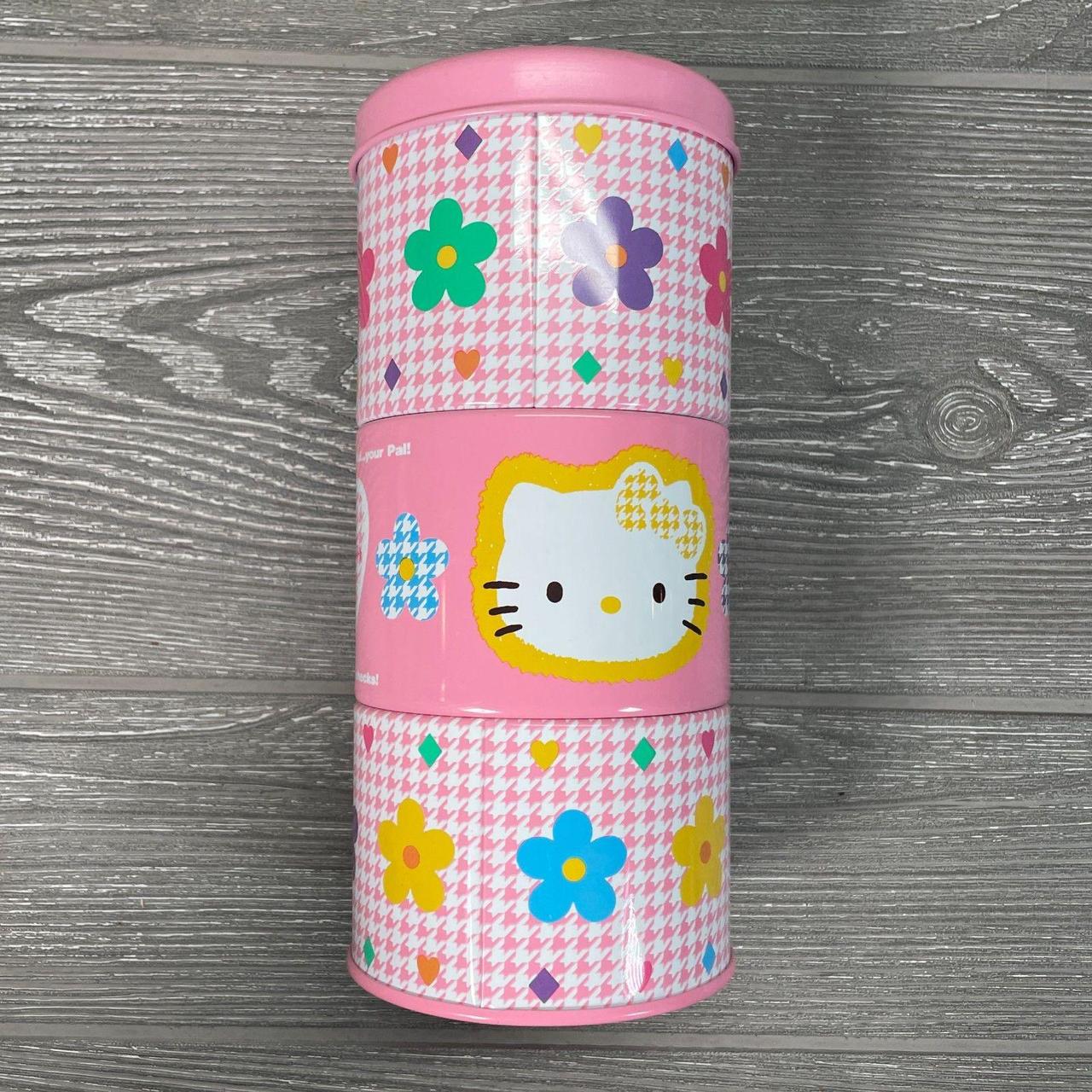 This amazing three-tiered Hello Kitty tin is from... - Depop