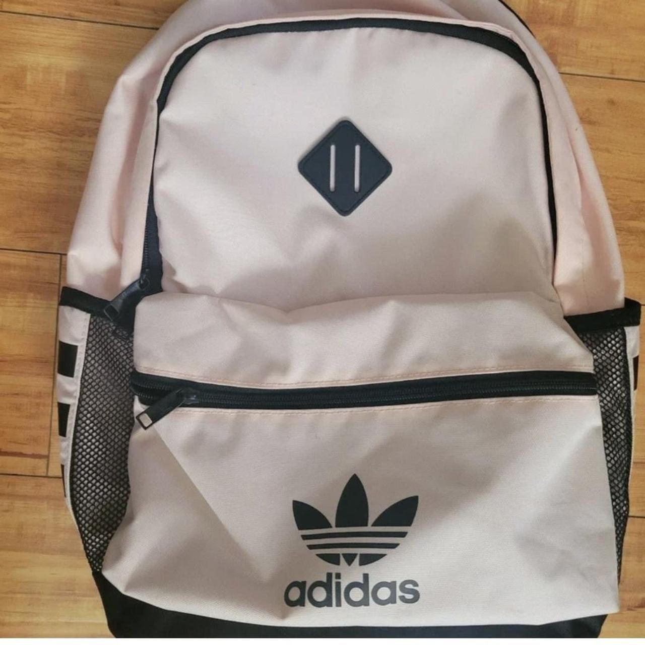 Adidas pink and black backpack with room on the... - Depop