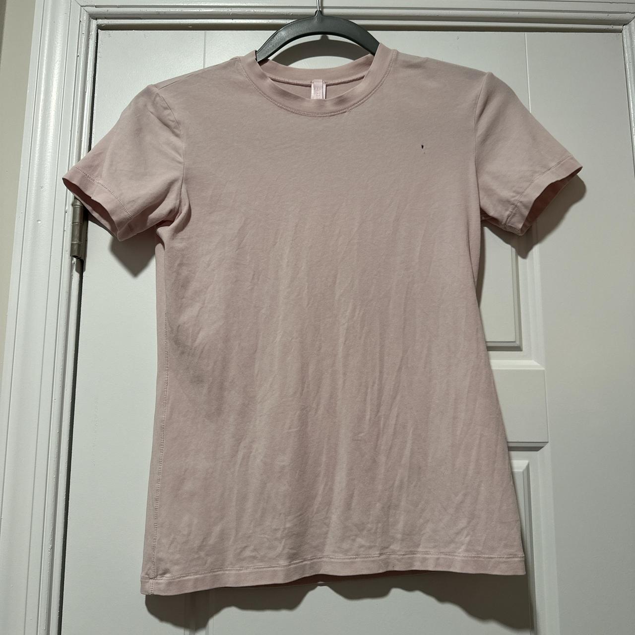 SKIMS pink tee has a small hole in the front ☹️ size... | Depop
