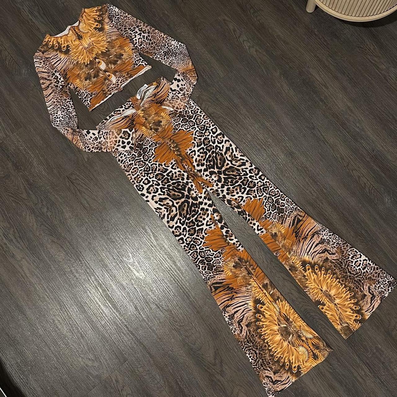 orange, black, and animal print bell bottom pants... | Depop