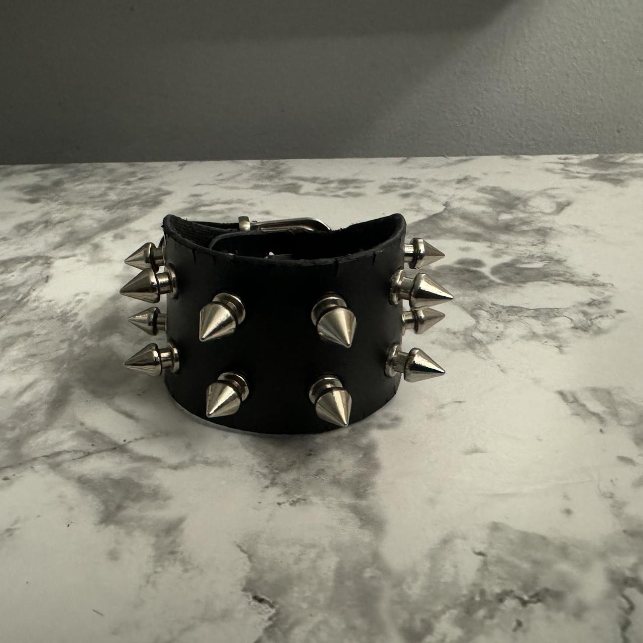 Black Studded Cuff with a little wear and tear shown... - Depop