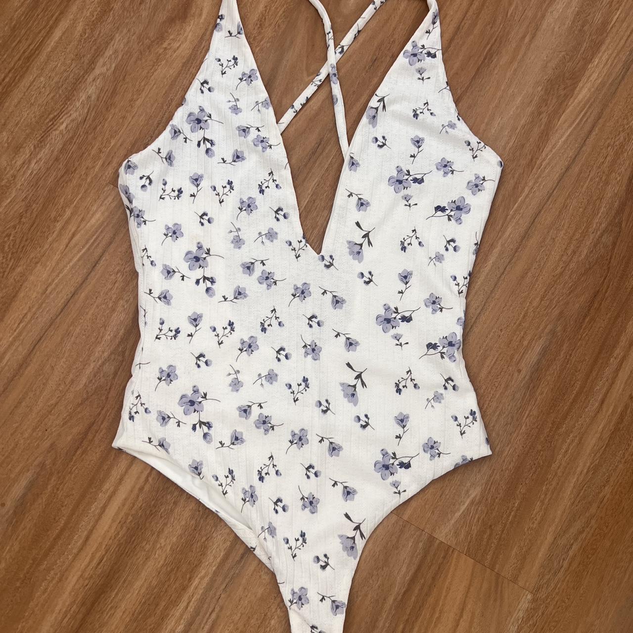 White bodysuit with purple flowers from Luvalot... | Depop