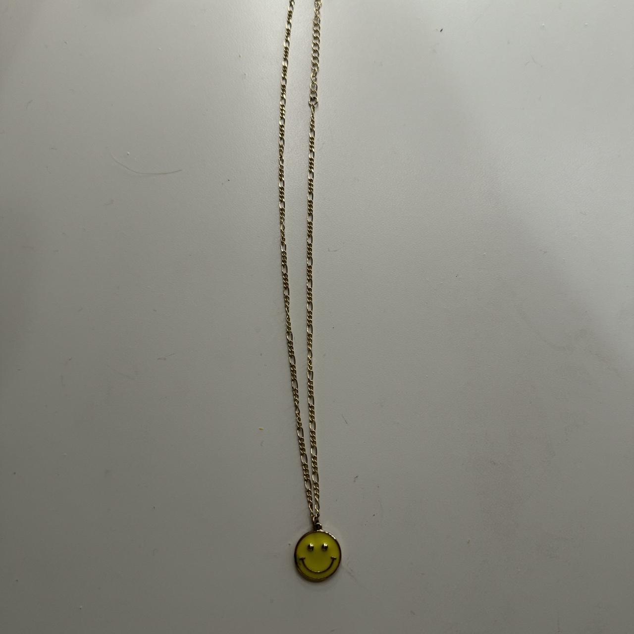 Yellow smiley face necklace... - Depop