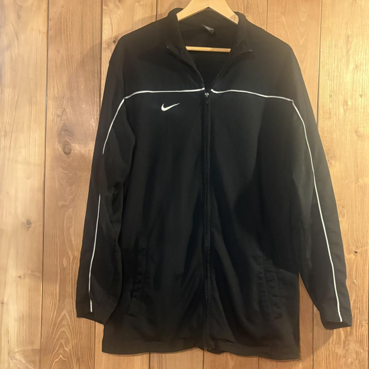 Black Nike track jacket with white details. Size... | Depop