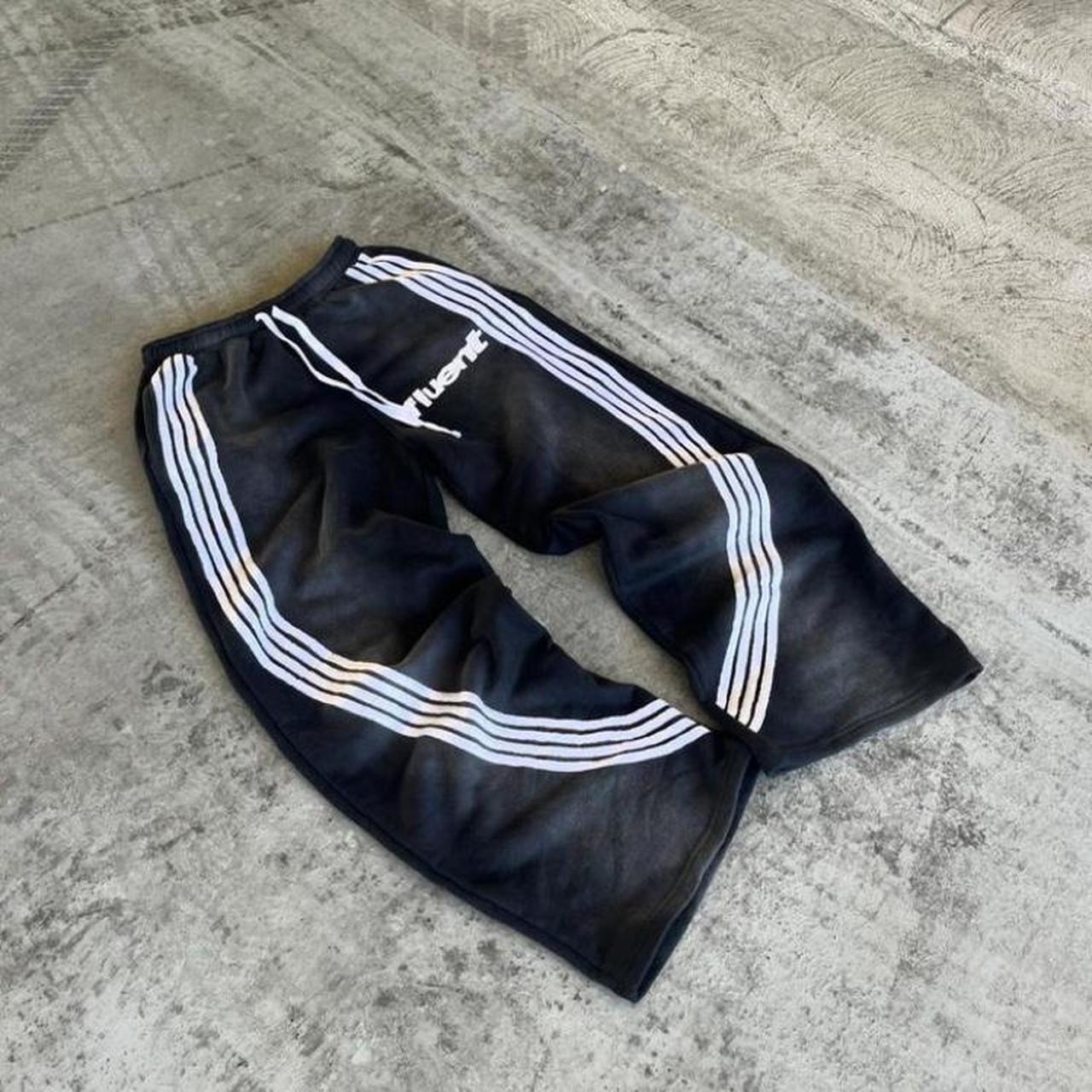 Black and white Fluent sweatpants, really baggy, 9.5... - Depop