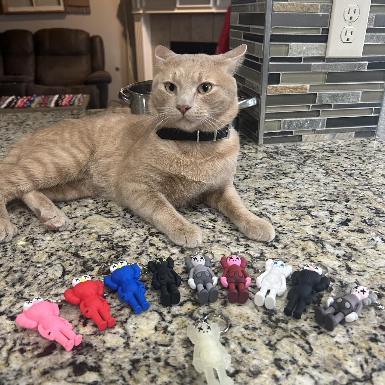 Kaws Collectible Keychain Grey and White Kaws... - Depop