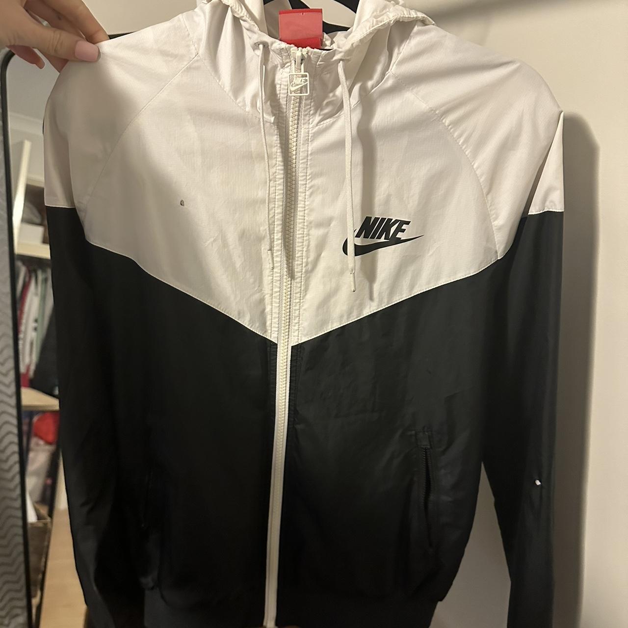 Black and white Nike wind sheeter, few small holes. - Depop