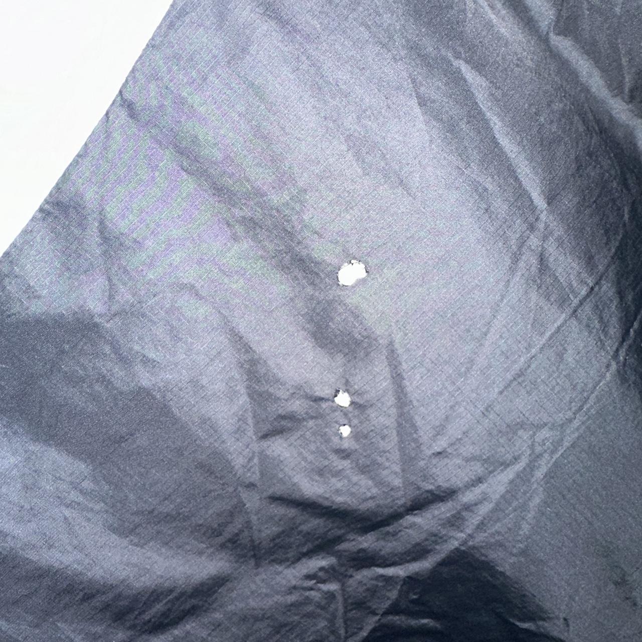 Black and white Nike wind sheeter, few small holes. - Depop