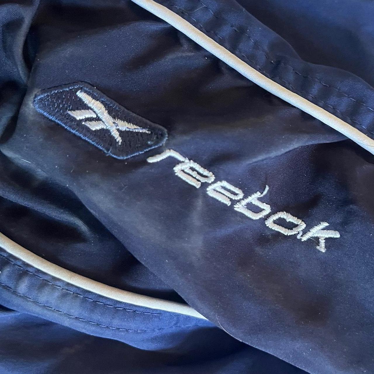 Navy Reebok tracksuit bottoms | Depop