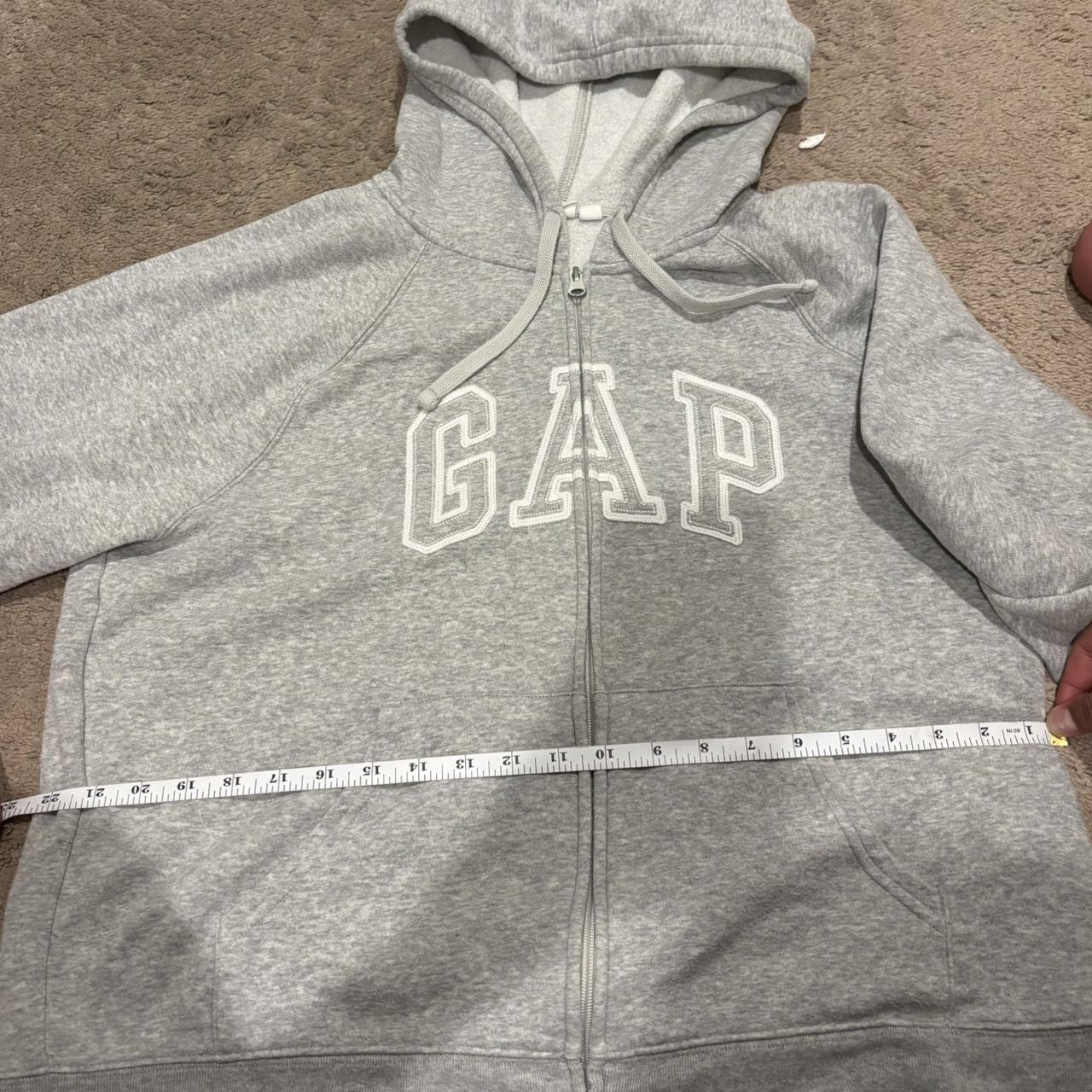 grey GAP zip up size large flaw: the zipper paint is... - Depop