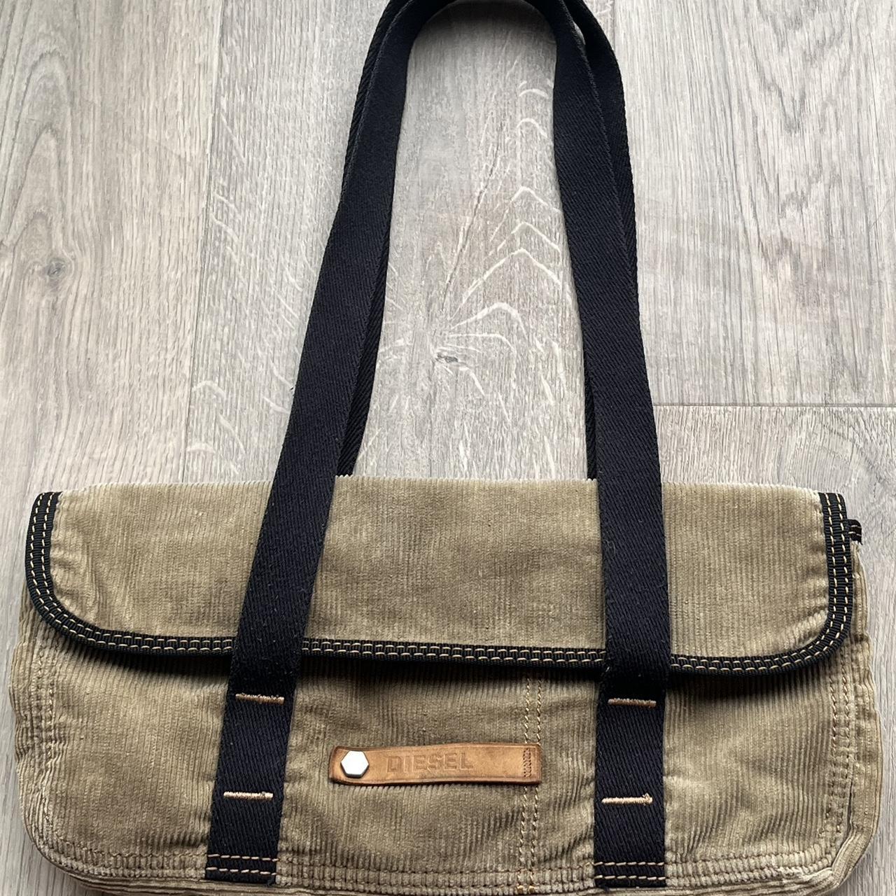 the diesel bag is original without stains and holes... - Depop