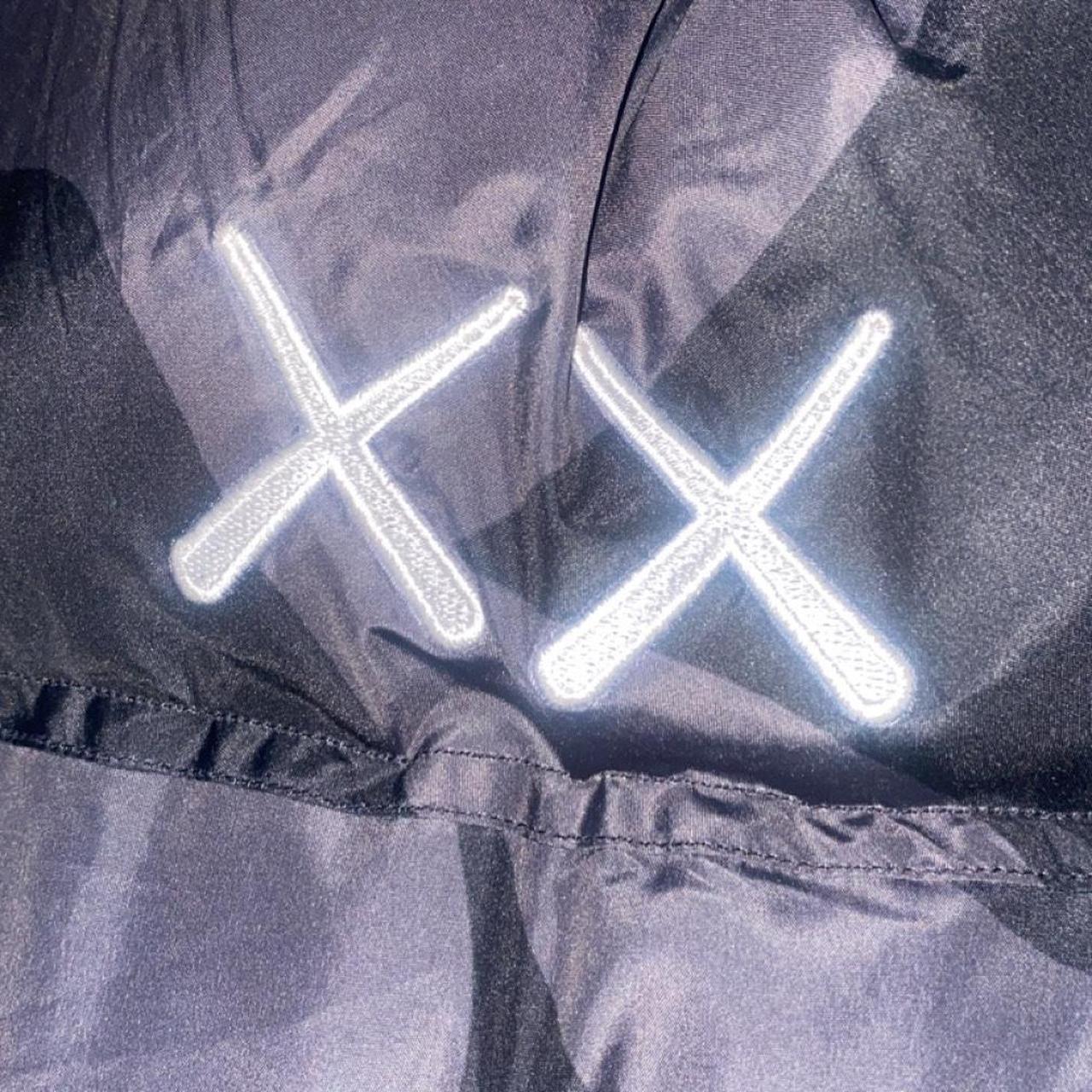 KAWS x The North Face Nuptse puffer jacket... - Depop