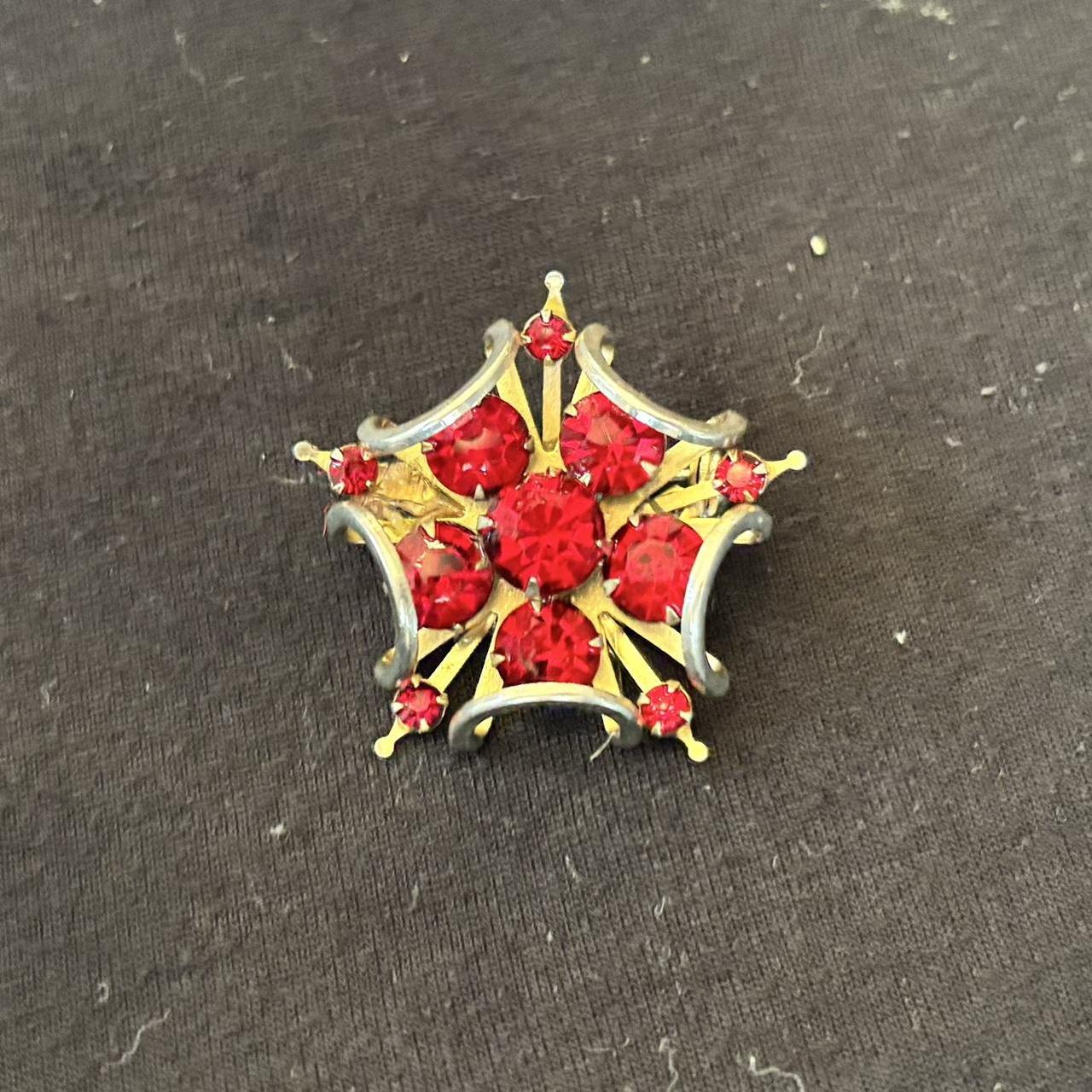 Small red vintage rhinestone brooch in silver toned... - Depop